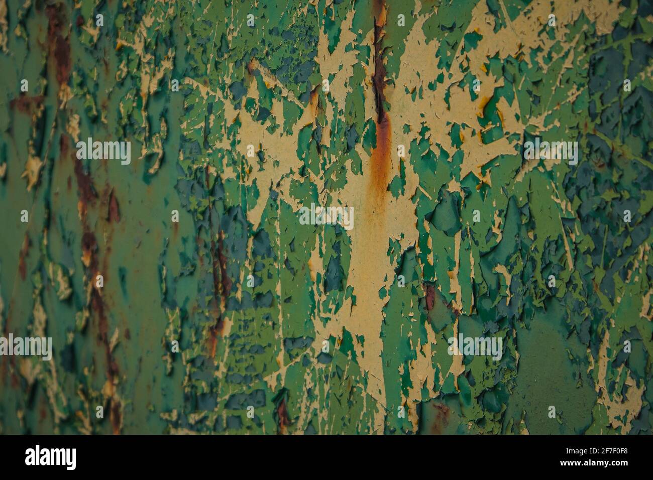 Chipped or cracked paint on rough old worn metal surface or panel ...