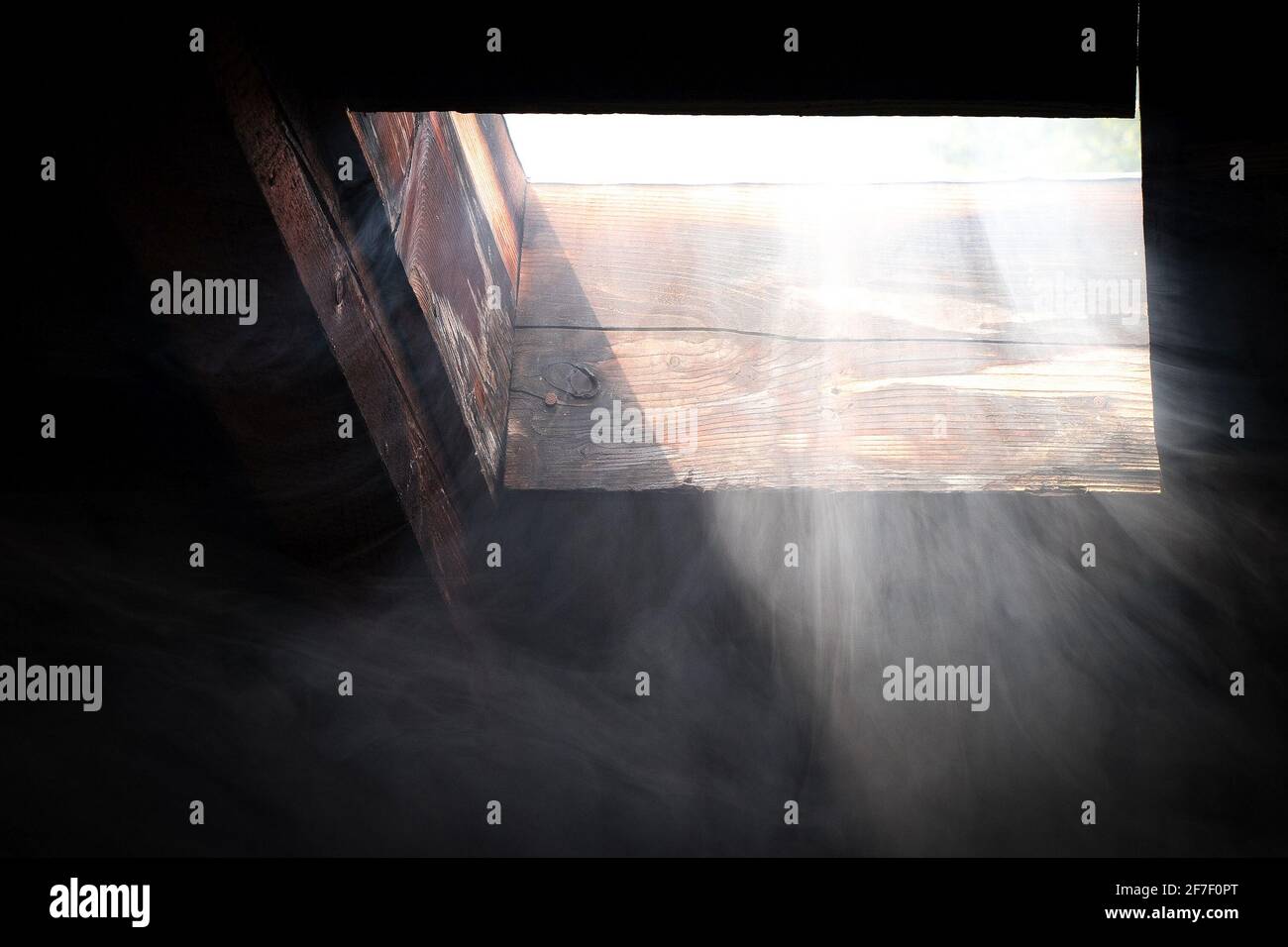 Visible flow of air through the attic window Stock Photo - Alamy