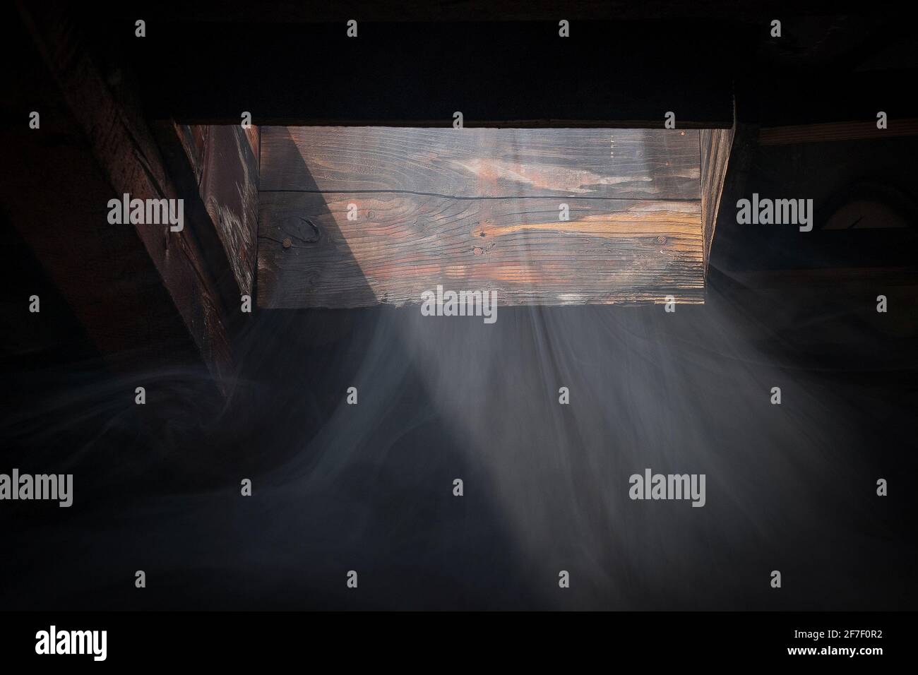Visible flow of air through the attic window Stock Photo - Alamy