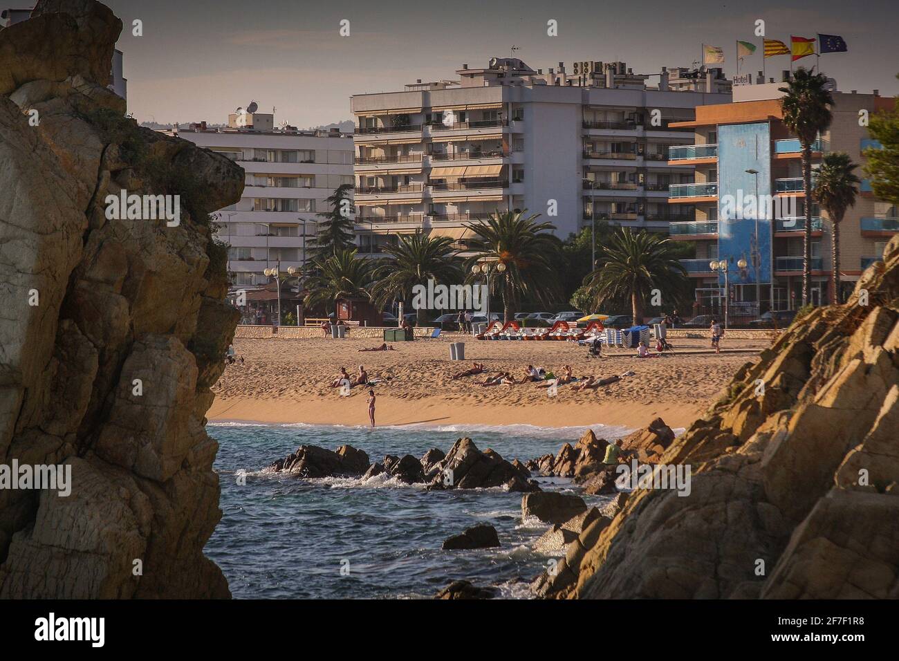 Fenals beach in Lloret de Mar area in Spain. Late hazy afternoon ...