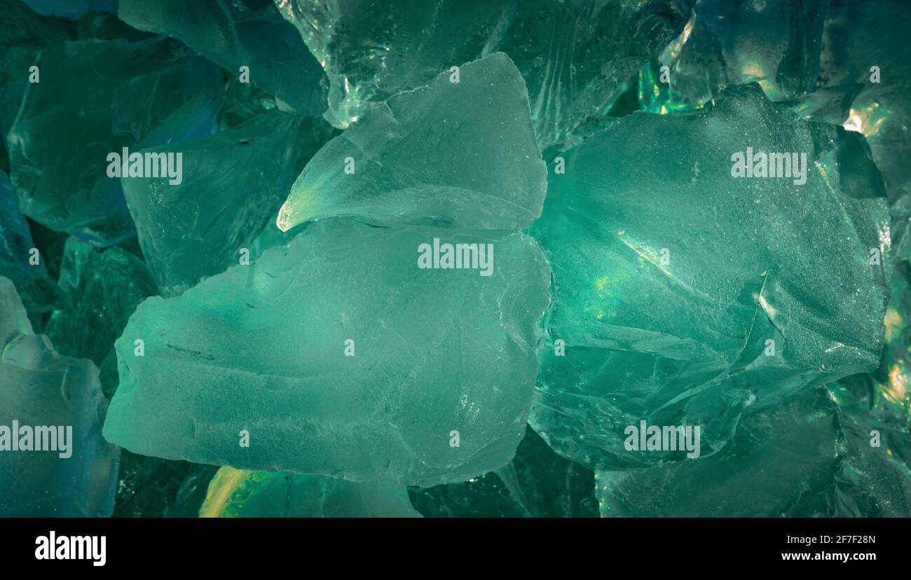 Green volcanic glass. Large cobblestones. Close-up, texture Stock Photo ...