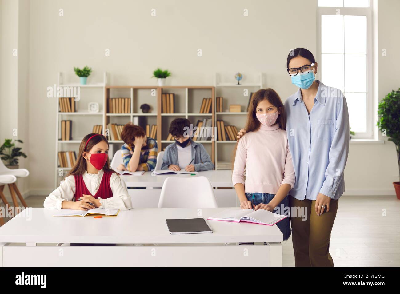 Children sitting desks in classroom hi-res stock photography and images ...