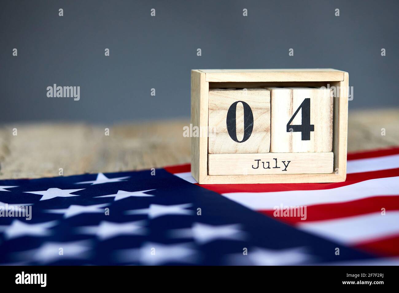 Wooden calendar with date on the background of the USA flag. Template ...