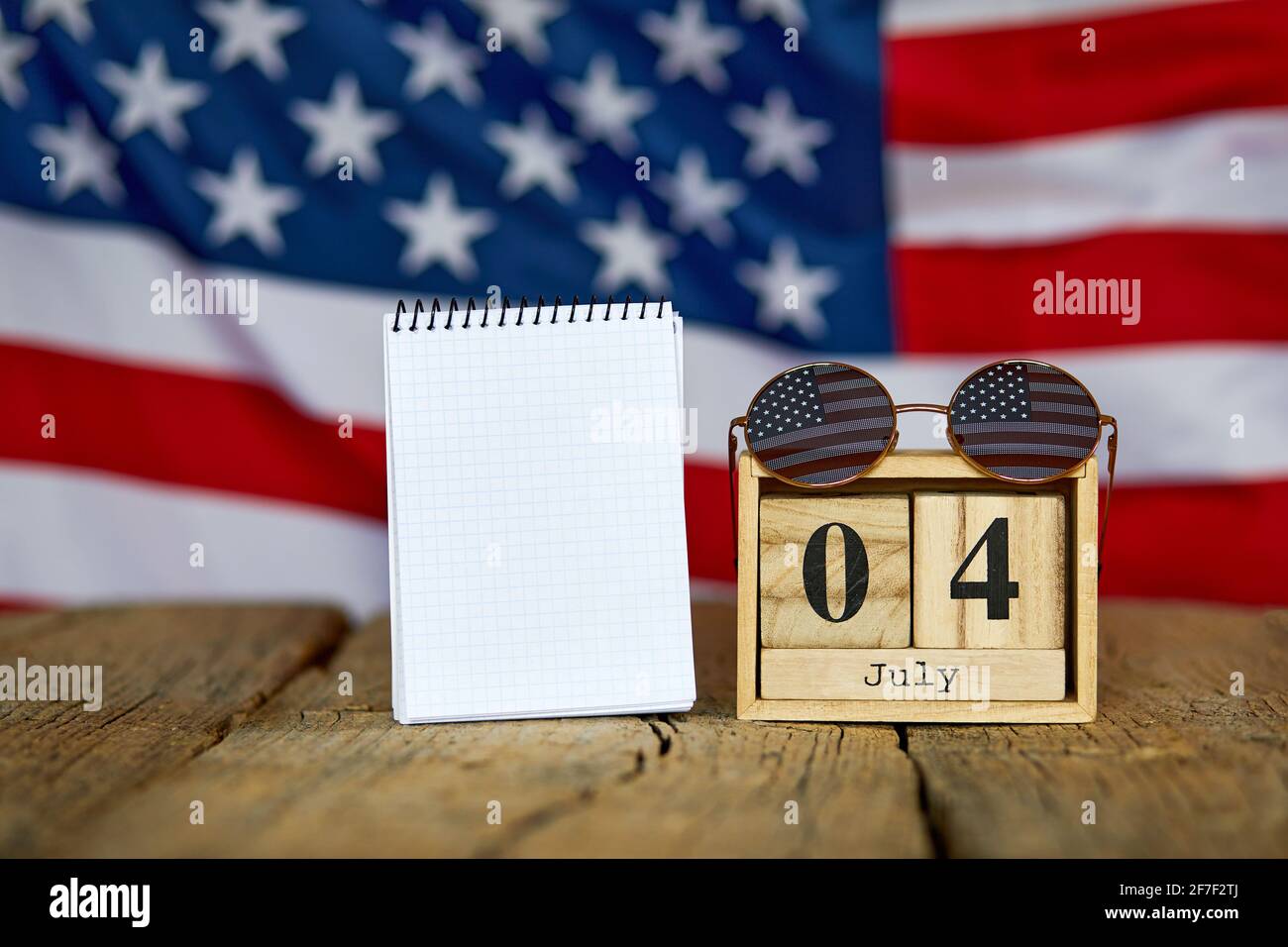Wooden calendar with numbers on which the image of the date of American ...