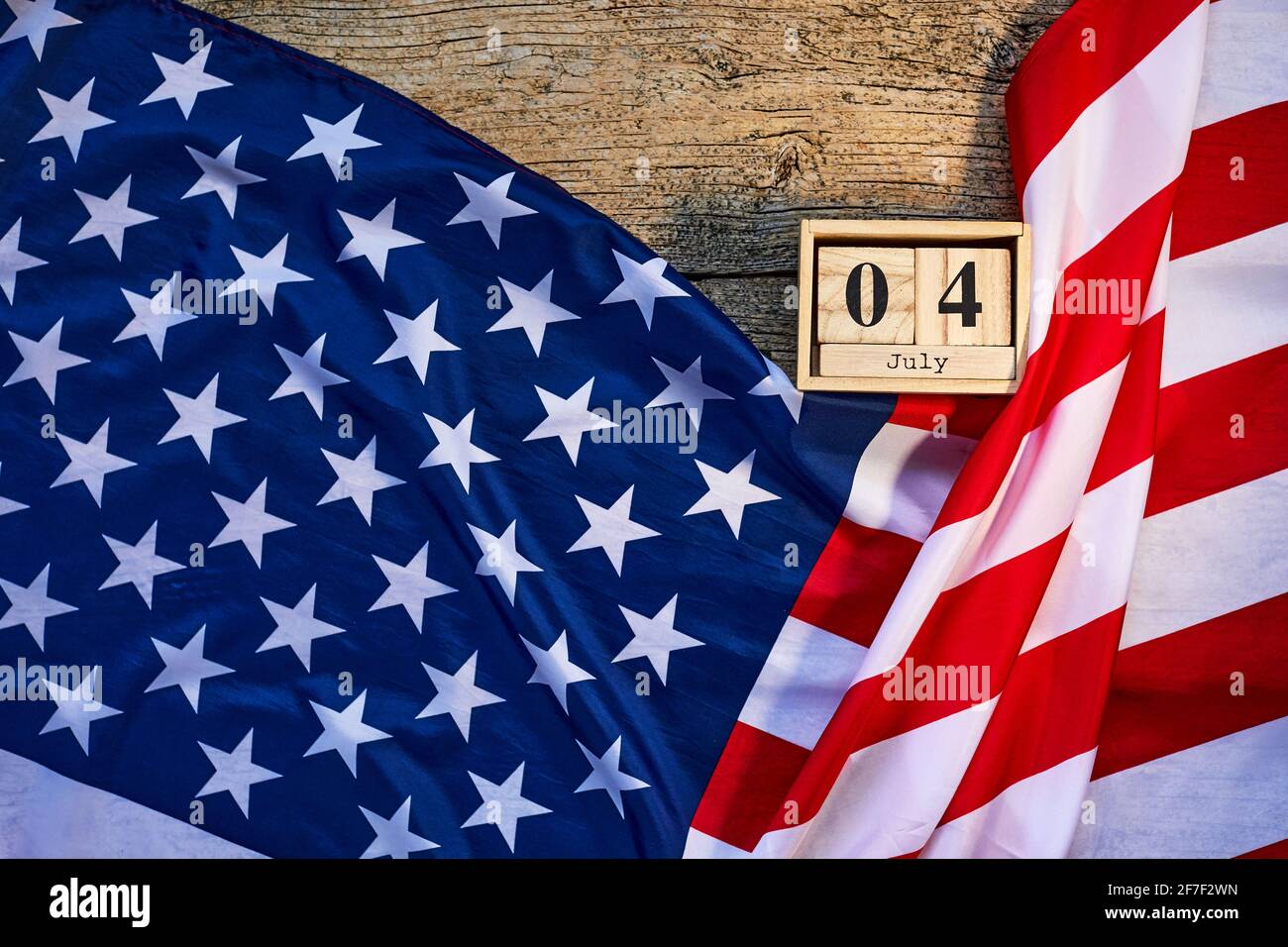 Wooden calendar with date on the background of the USA flag. Template ...