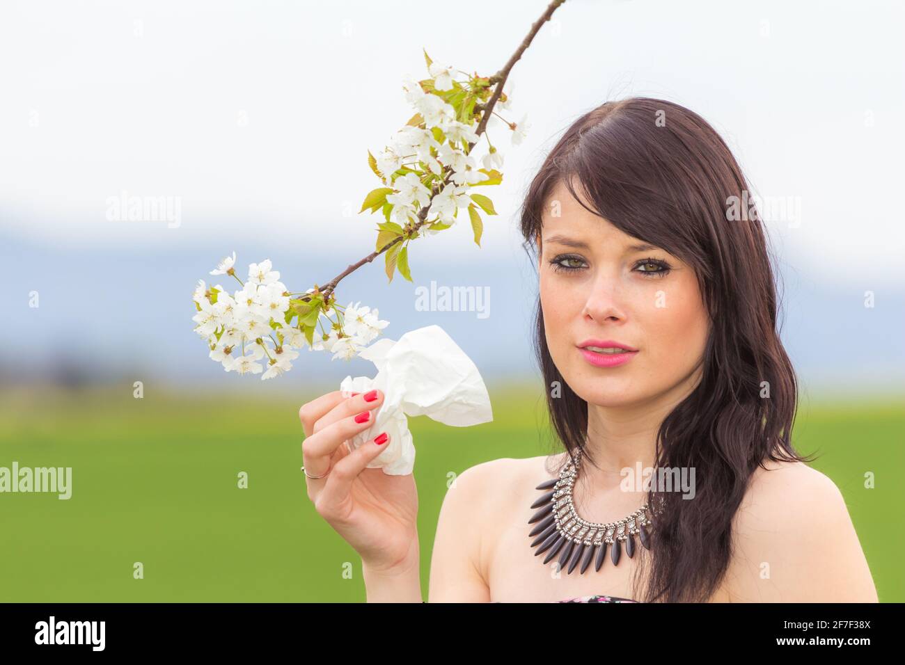 Ill hayfever girl in spring nature with blossom needs therapy. Health ...