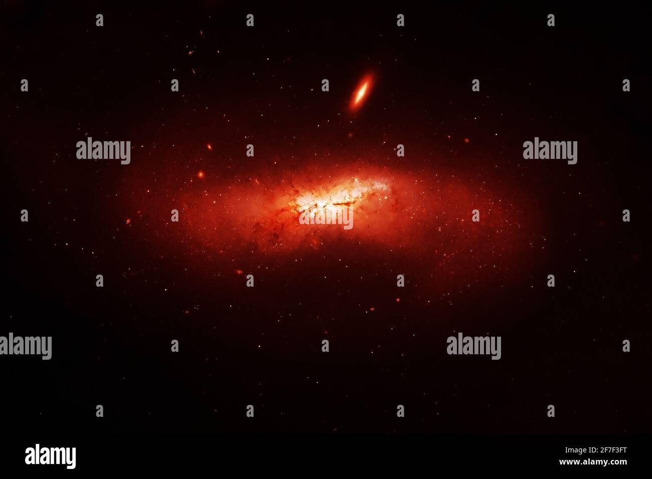 Galaxy in red colors. Elements of this image were furnished by NASA ...