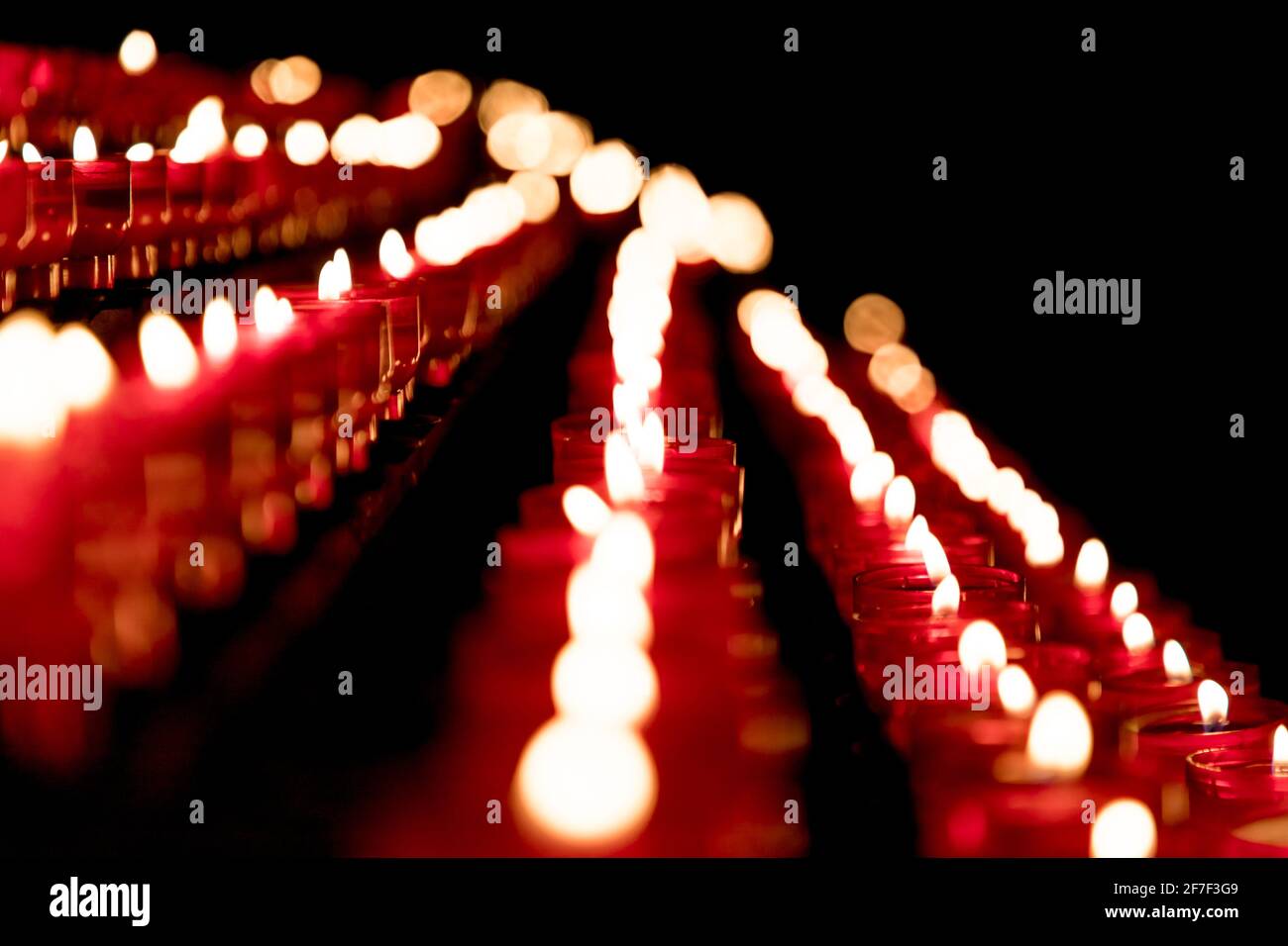 Group of red candles in church for faith resurrection prayer ...