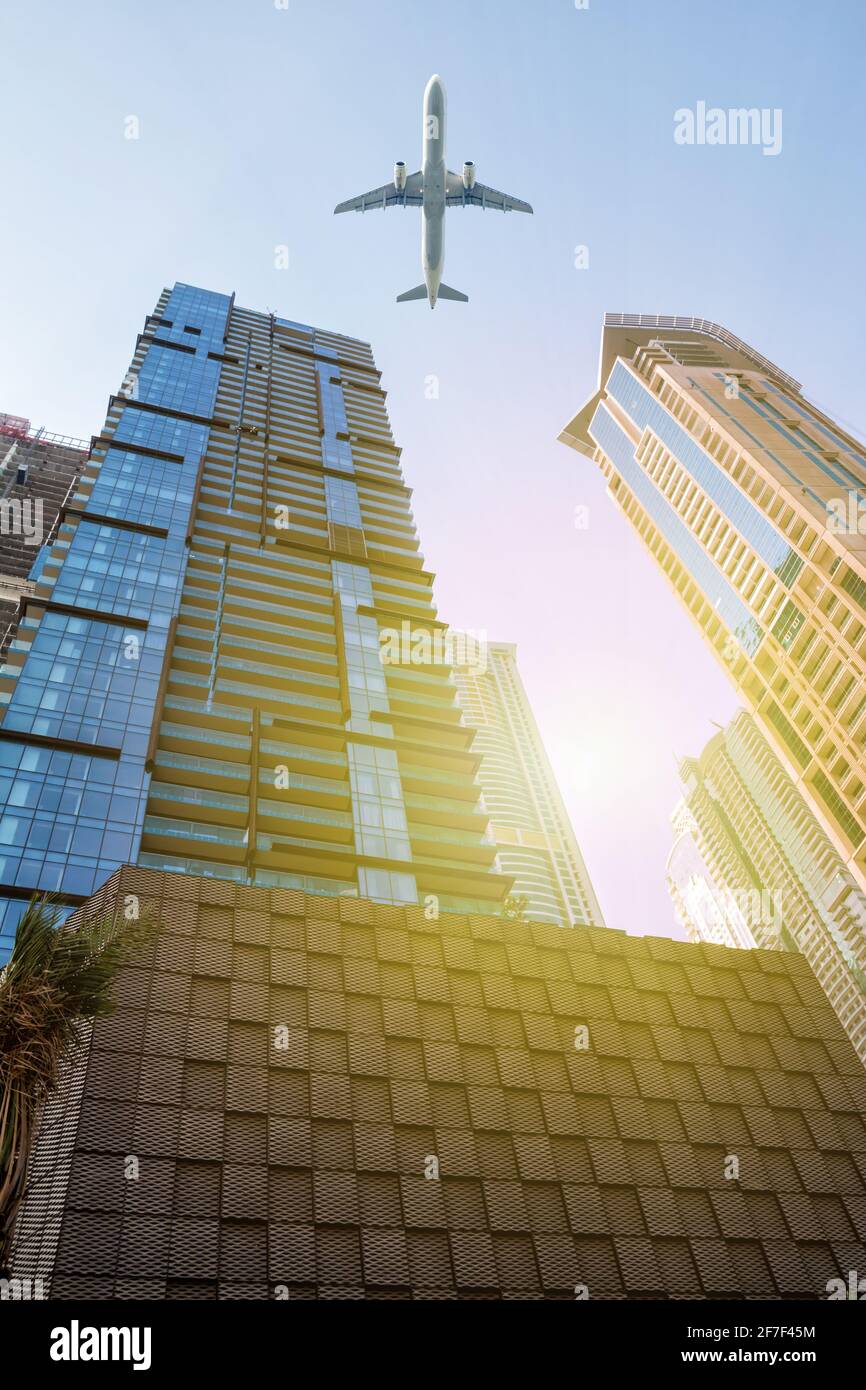 Skyscraper facades on a bright sunny day with sunbeams in the blue sky ...