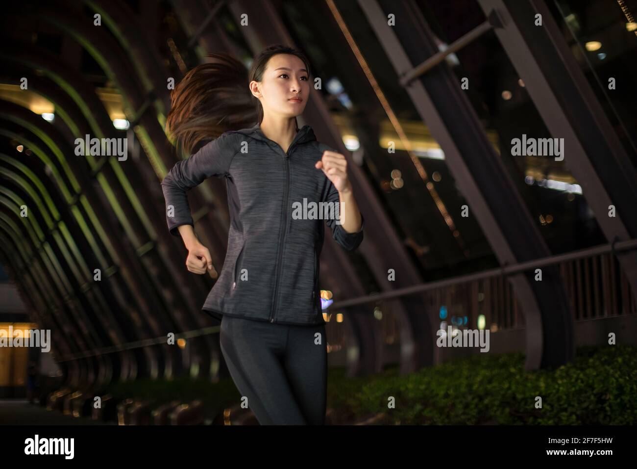 Woman running away night hi-res stock photography and images - Alamy