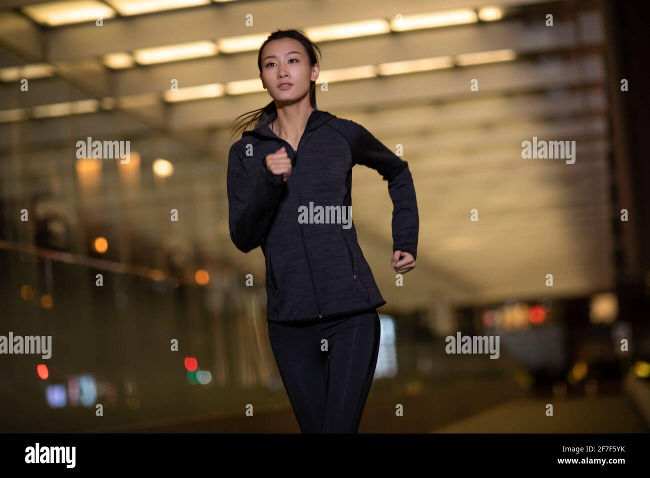Woman running away night hi-res stock photography and images - Alamy