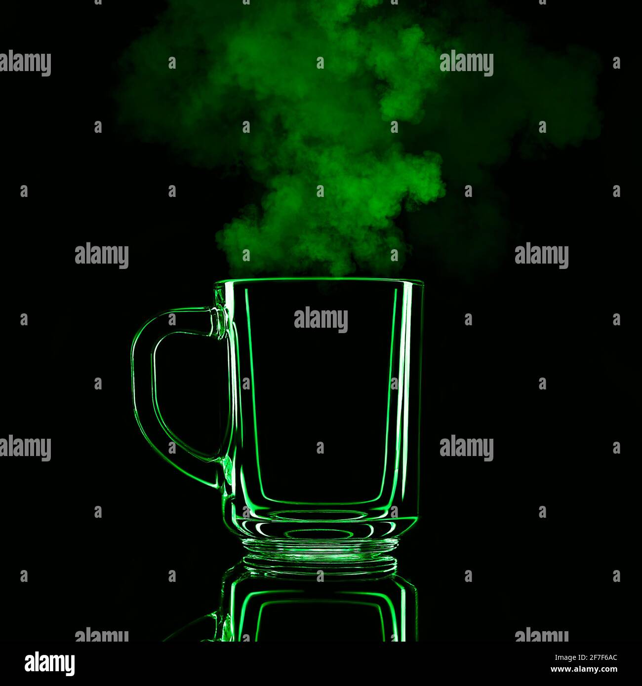 Just a glass on a black background with a reflection. Green color, with ...