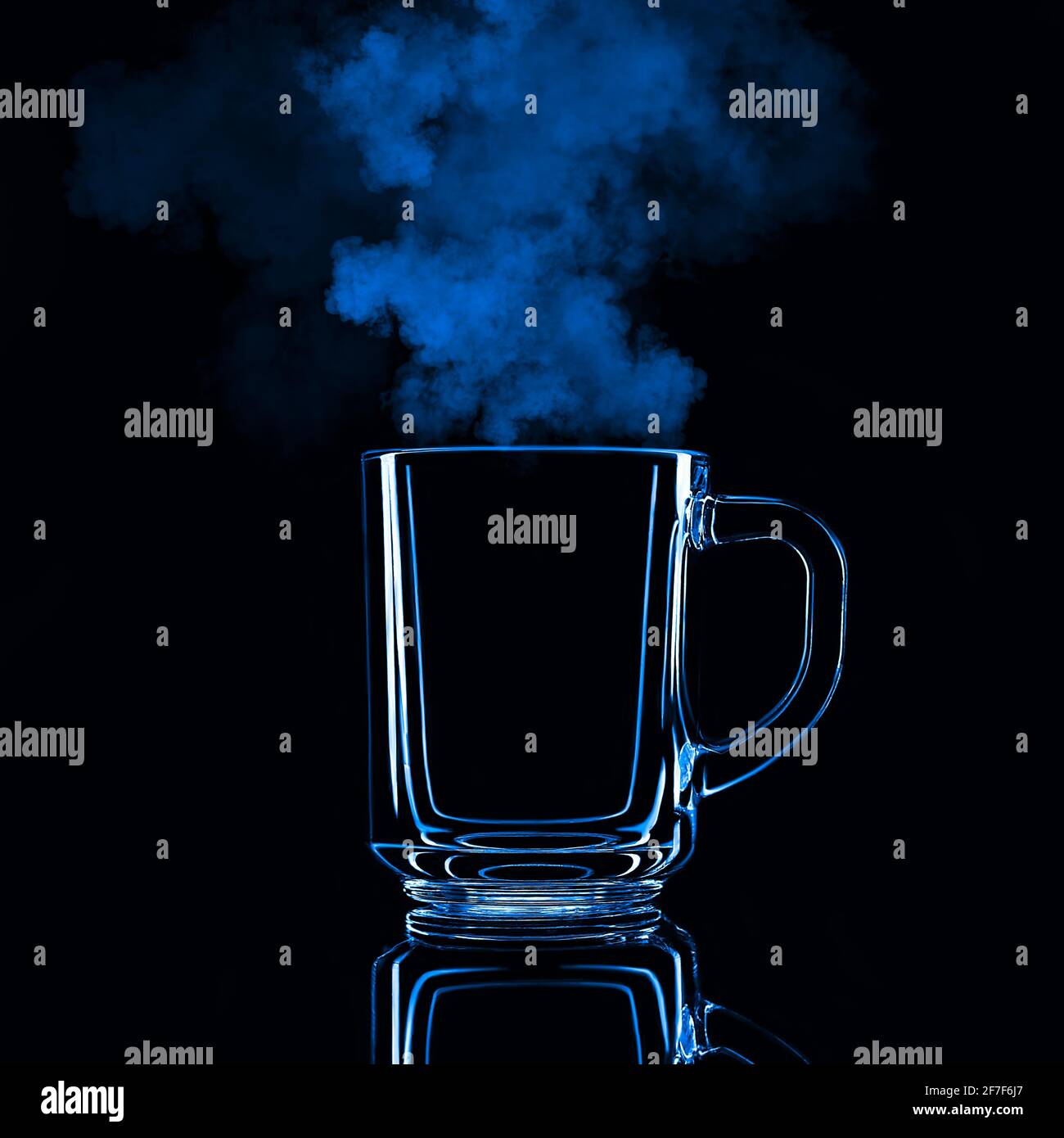 Just a glass on a black background with a reflection. Blue color, with ...