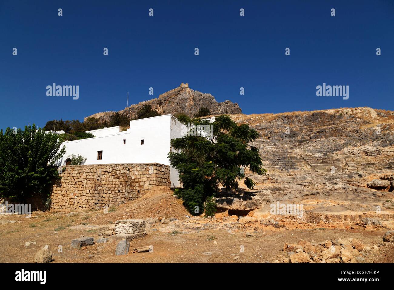 WHite house belowf the citadel of the Lindian Acropolis in Lindos on ...
