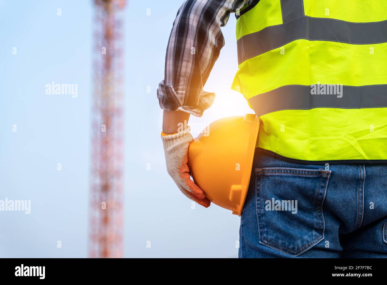 Engineer technician holding helmet in construction site and ...