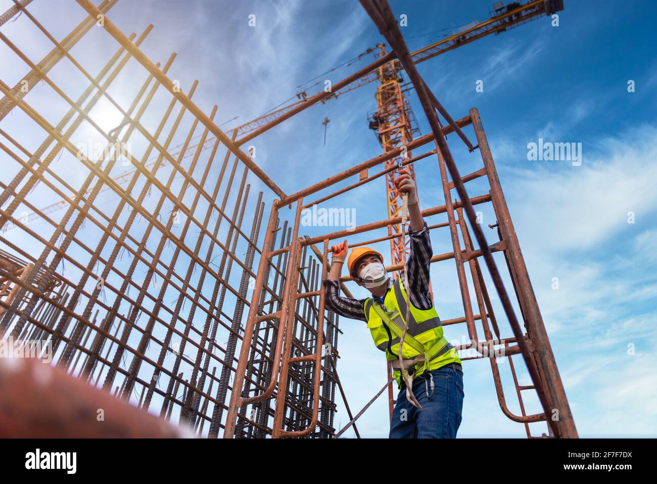 Asian worker working on steel structure at height equipment ...