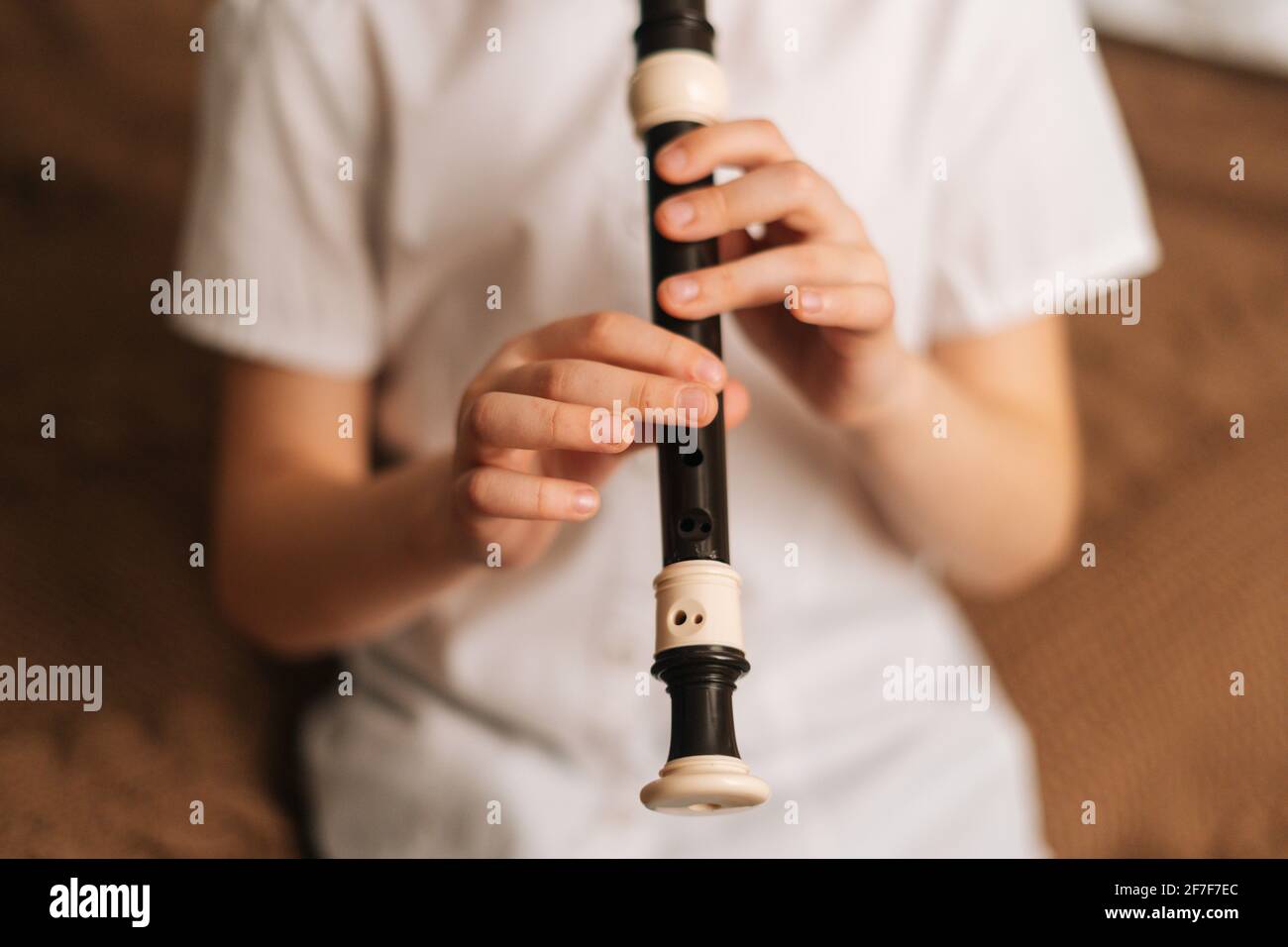 Girl playing flute hi-res stock photography and images - Alamy