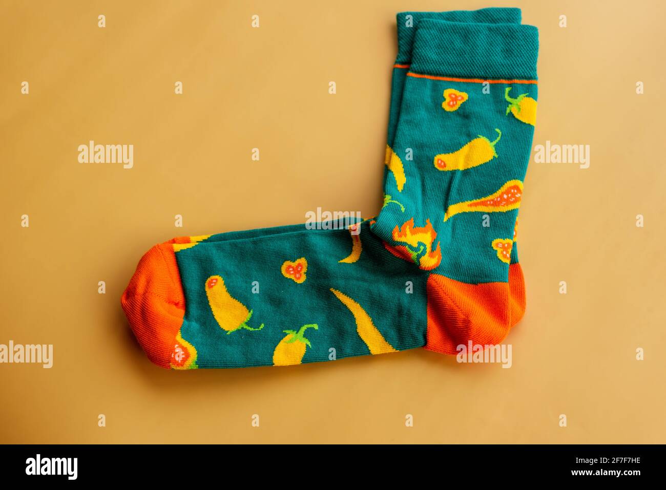 Colorful sock on beige background, top view. Knitted socks Stock Photo ...