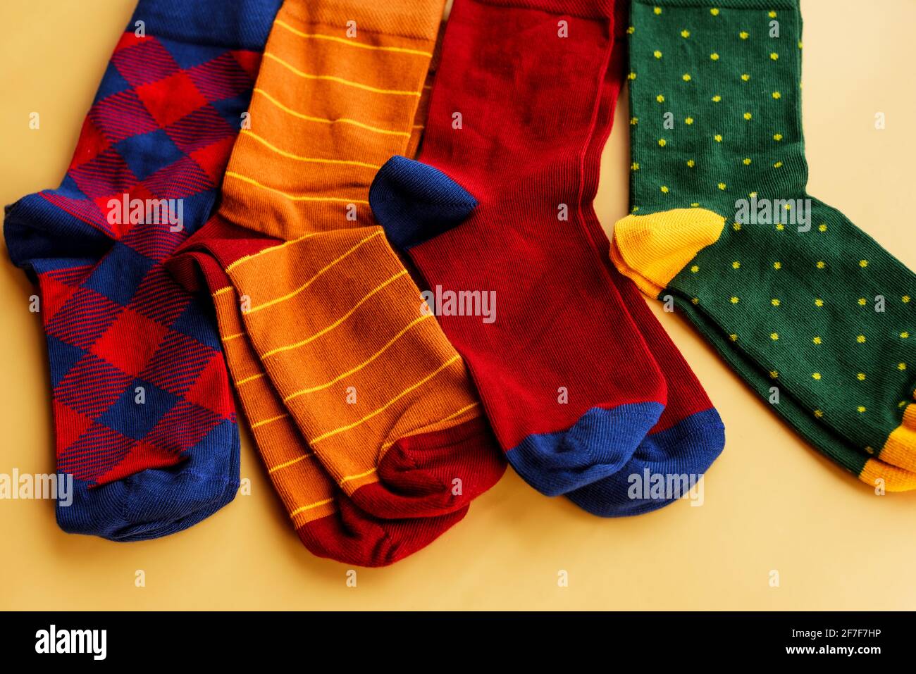 Colorful sock on beige background, top view. Knitted socks Stock Photo ...