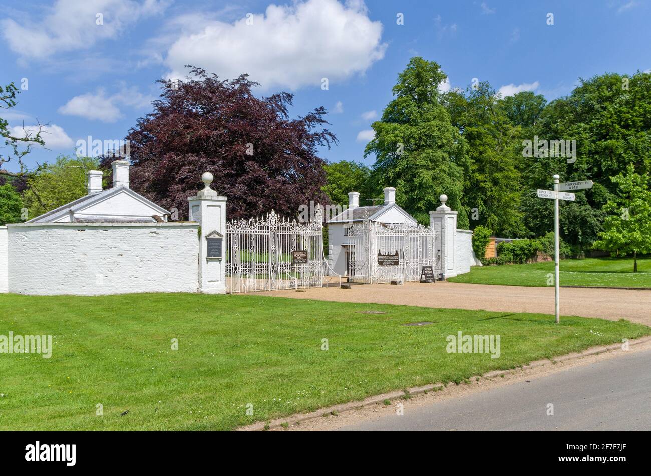 Gates at the entrance to Houghton Hall, a stately home in Norfolk, UK ...
