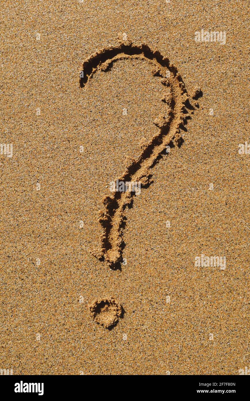 The inscription question mark on the sand by the ocean Stock Photo - Alamy