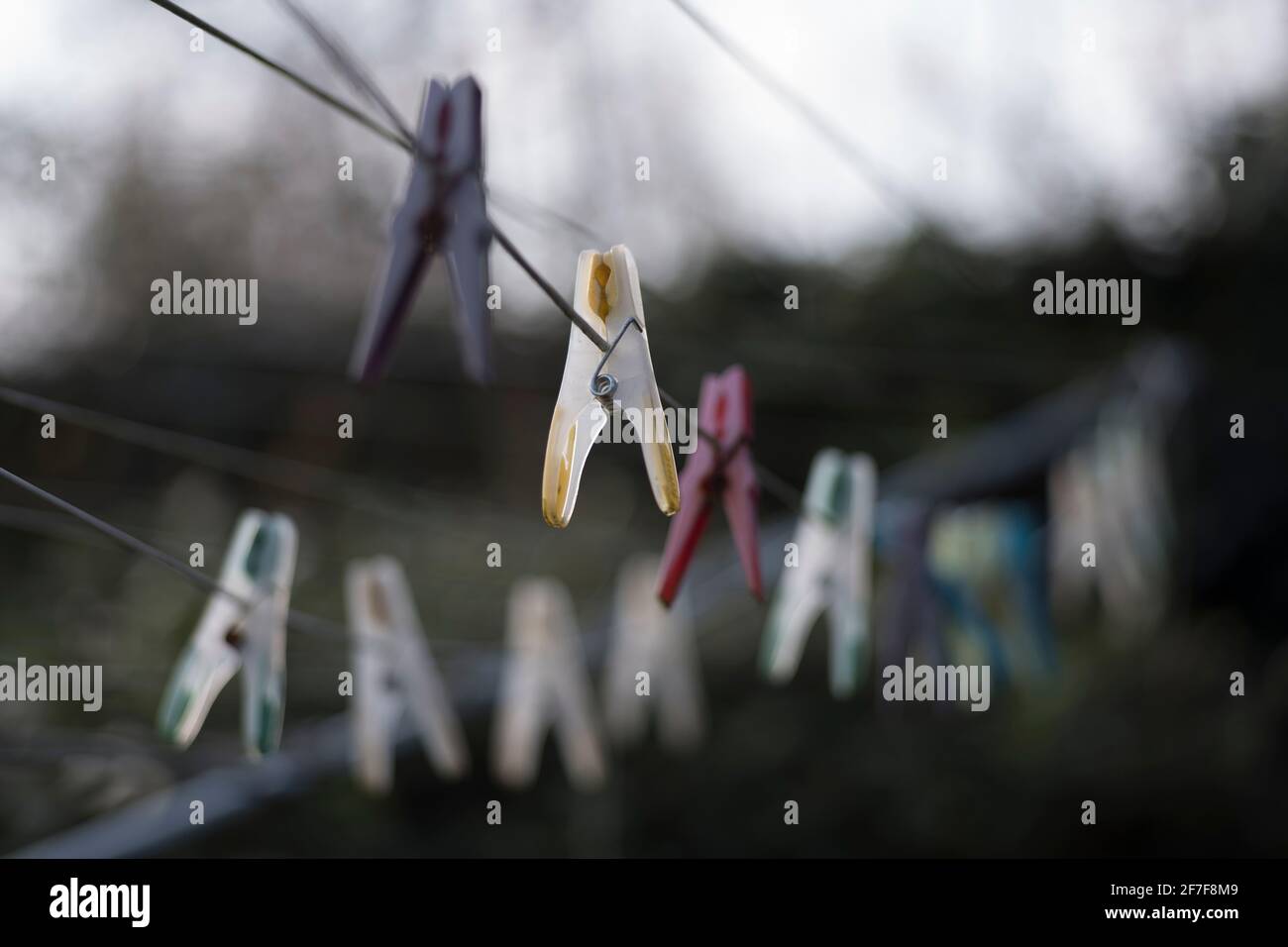 Pegs on a washing line Stock Photo - Alamy