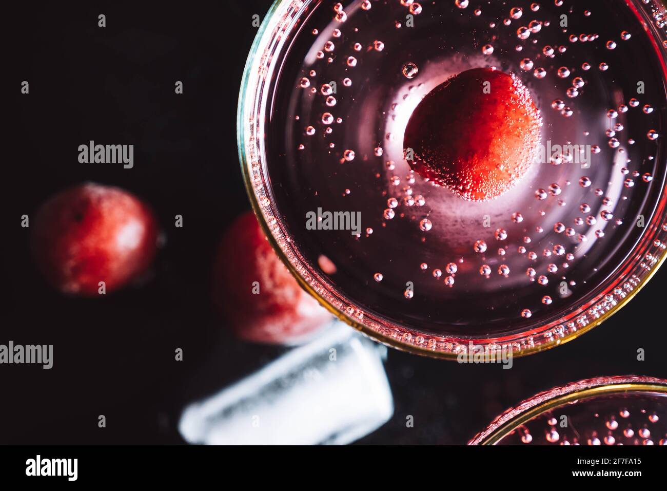 Red cherry cocktail drink isolated on black background. Top view Stock ...