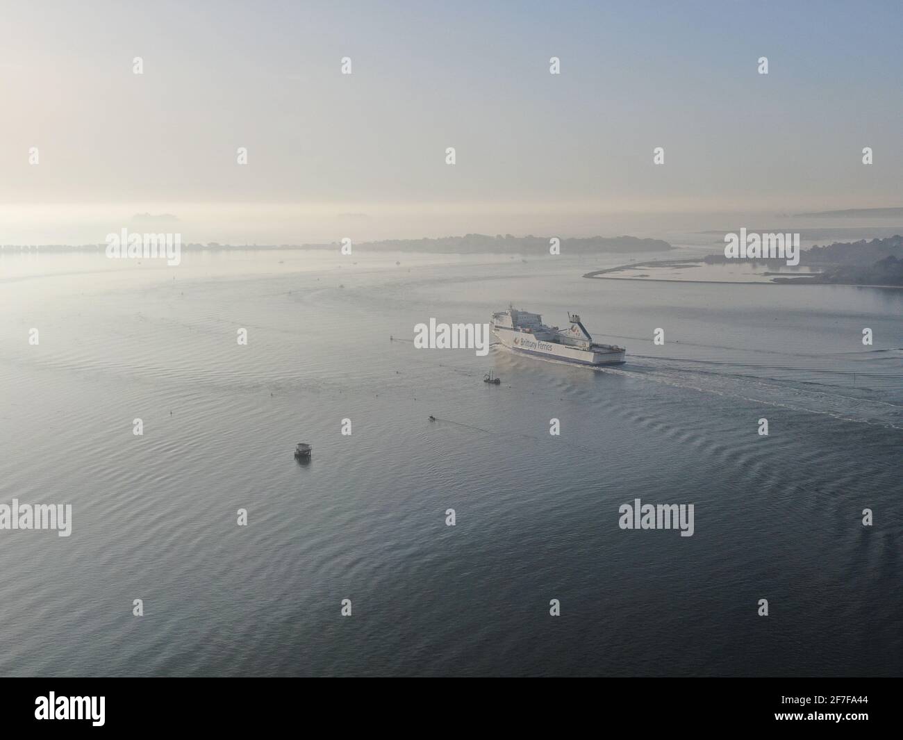 aerial view of ferry boat sailing through Poole Harbour on a beautiful ...