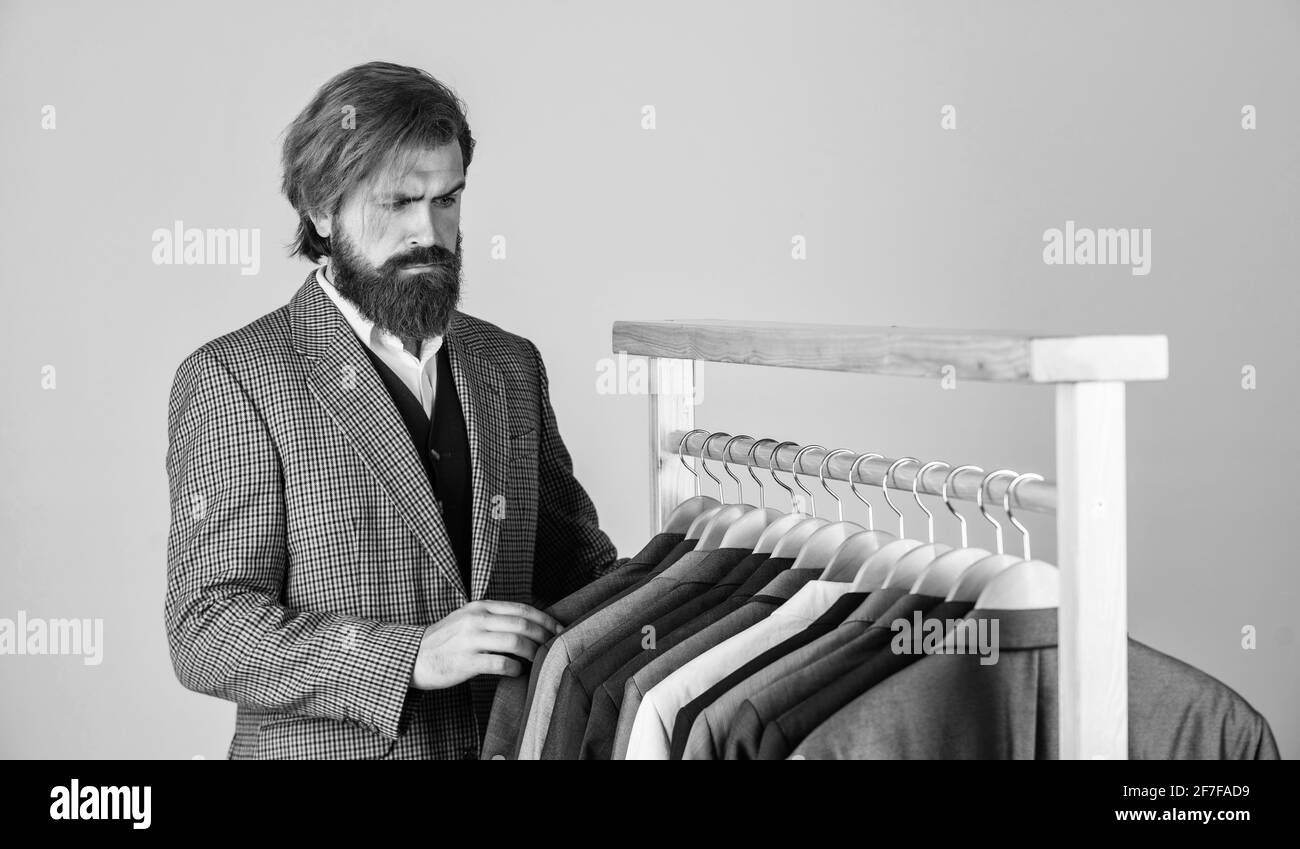 In search of inspiration. bearded man tailoring clothes. formal and ...