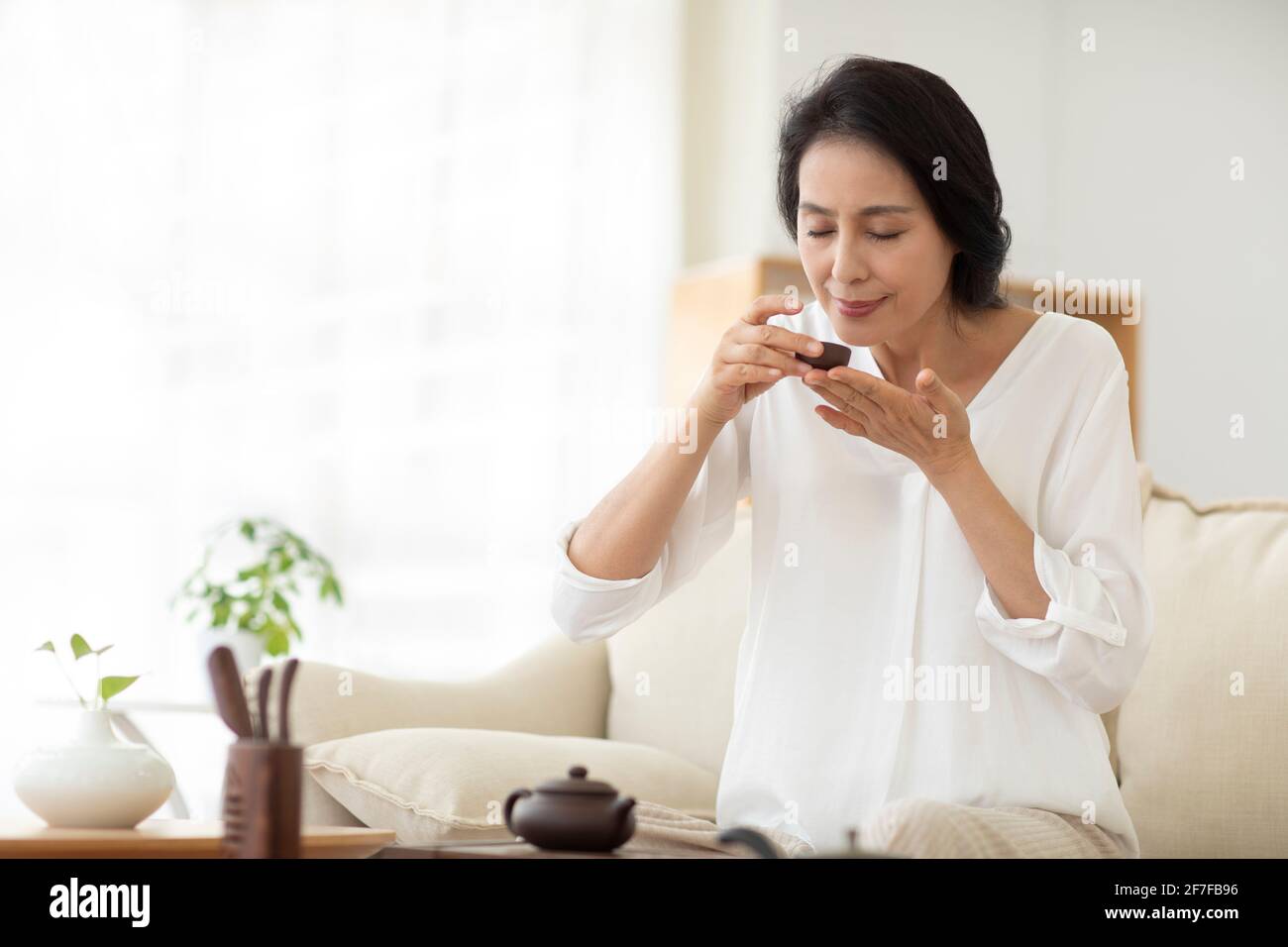 Mature woman tea tasting hi-res stock photography and images - Alamy