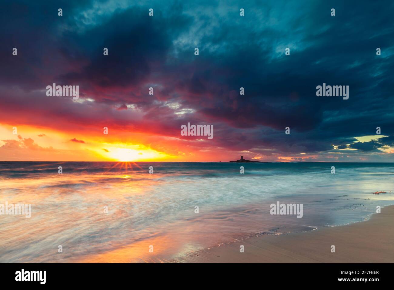 Colorful sunset on the beach Stock Photo - Alamy