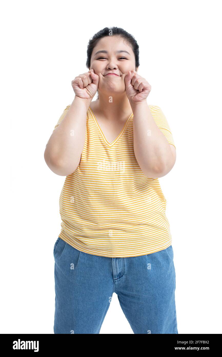 Young woman acting cute Stock Photo - Alamy