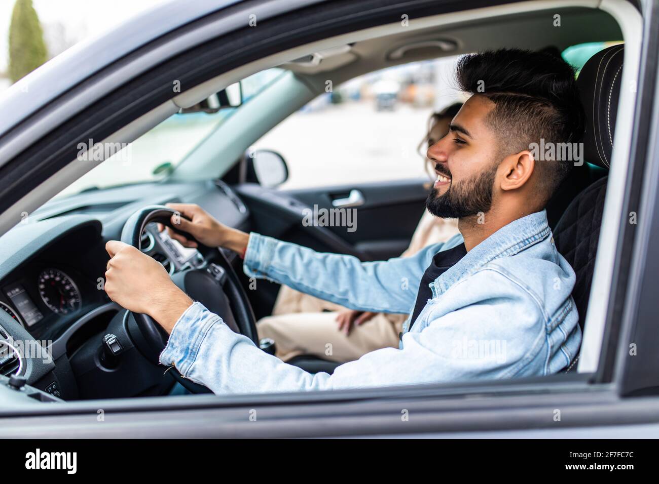 Handsome indian man driving car hi-res stock photography and images - Alamy