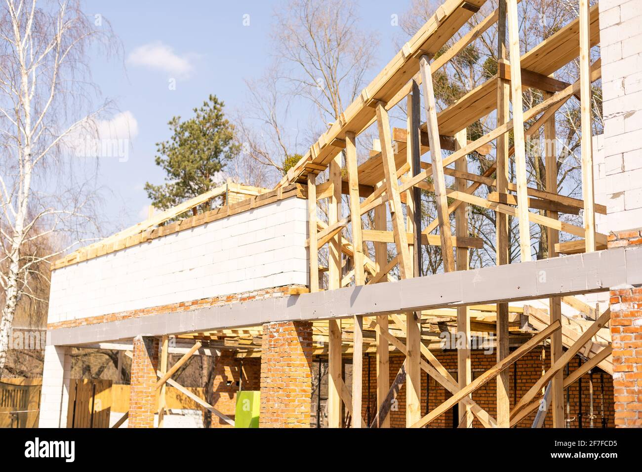 Facade of building made from white blocks with big windows under ...