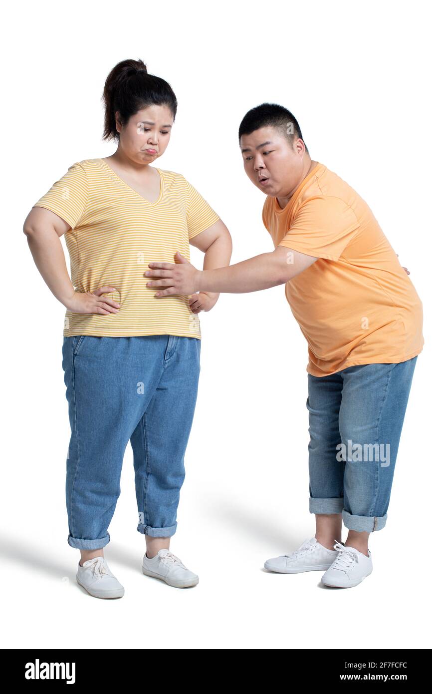 Overweight young couple Stock Photo - Alamy