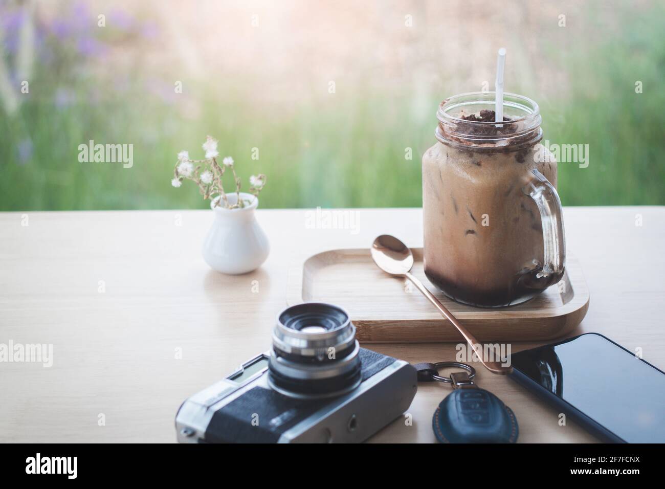 Ice coffee,Key smart phone and film camera in cafe Stock Photo - Alamy