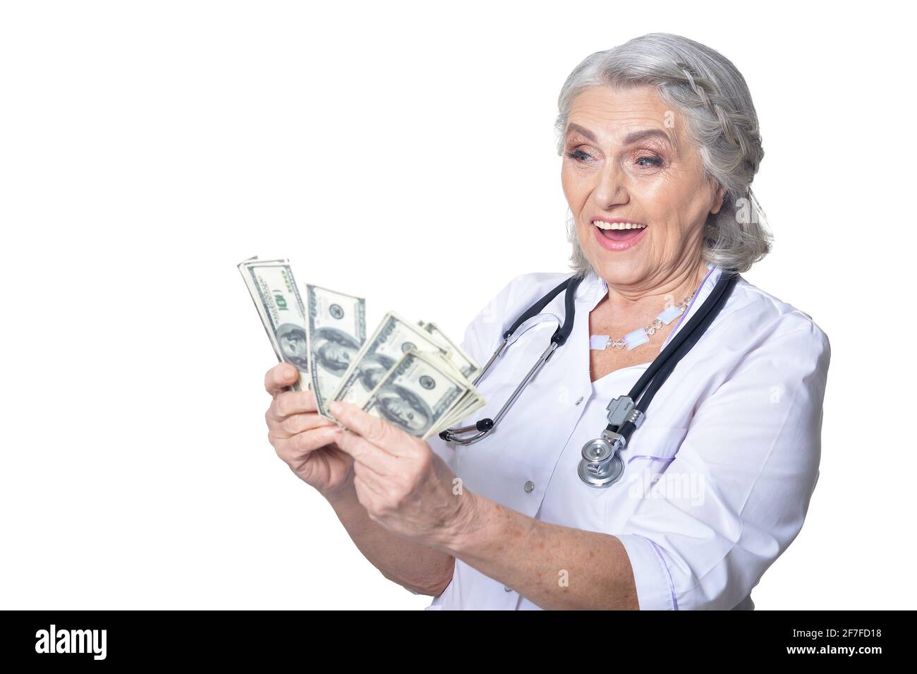 Portrait of female doctor holding money bills Stock Photo - Alamy