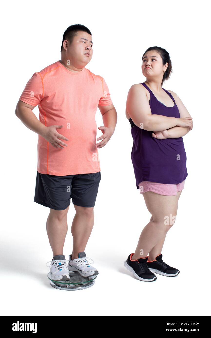 Overweight young couple Stock Photo - Alamy