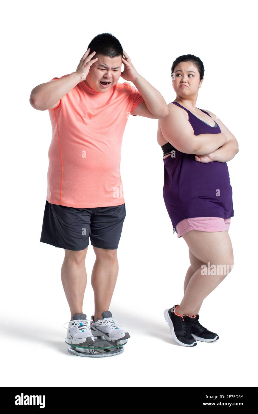 Overweight young couple Stock Photo - Alamy