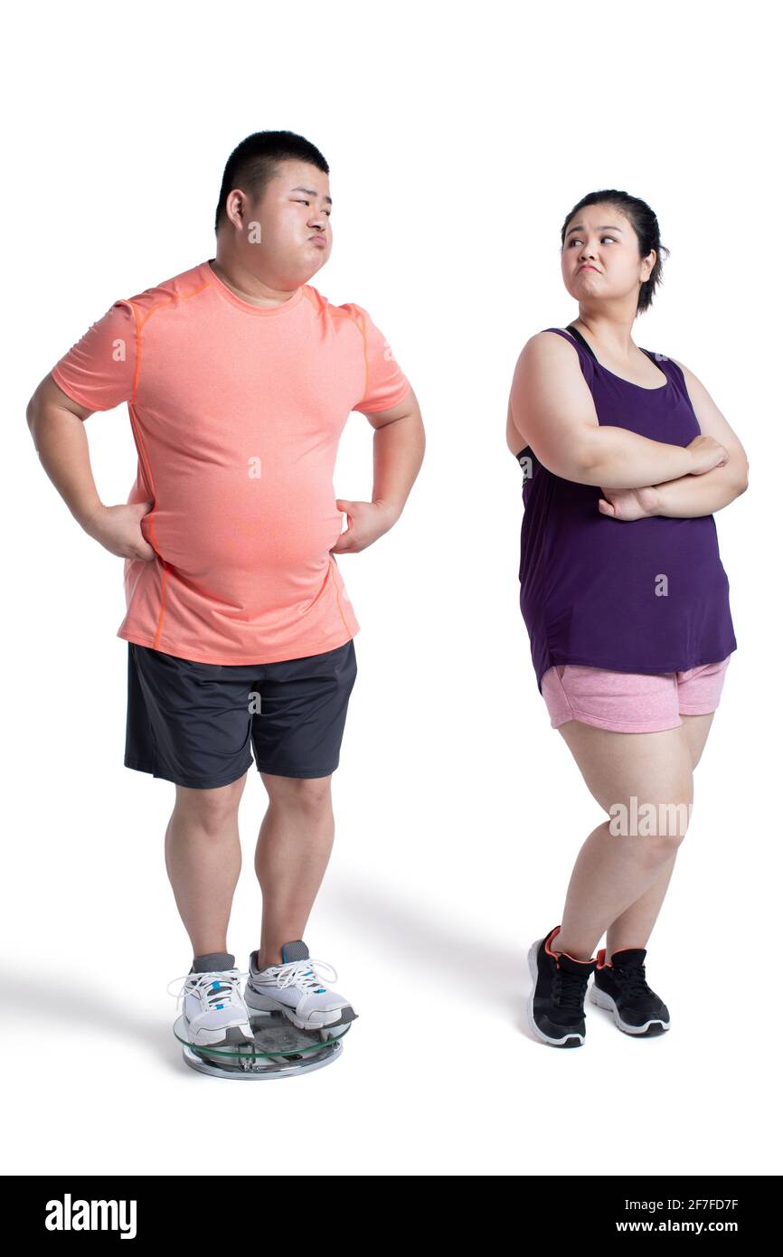 Overweight young couple Stock Photo - Alamy
