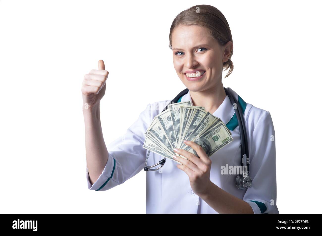 Close up portrait of female doctor holding money Stock Photo - Alamy
