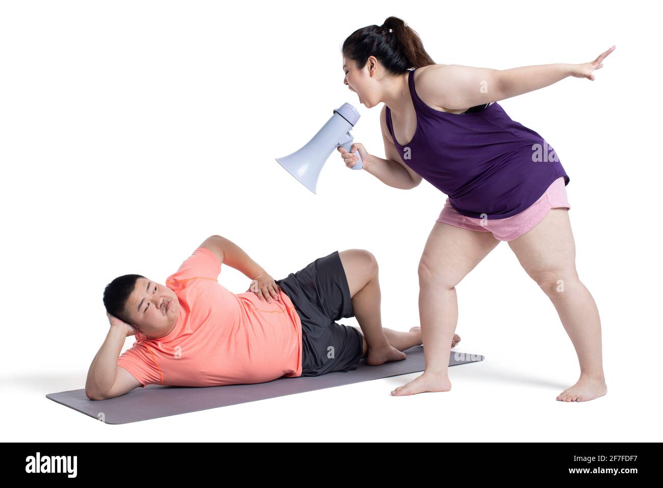 Overweight young couple exercising Stock Photo - Alamy
