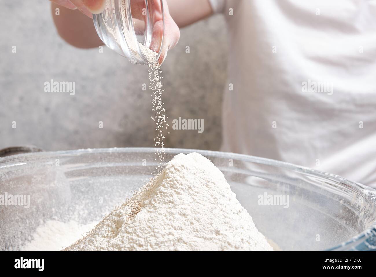 Flour is sieved with a metal sieve Stock Photo - Alamy