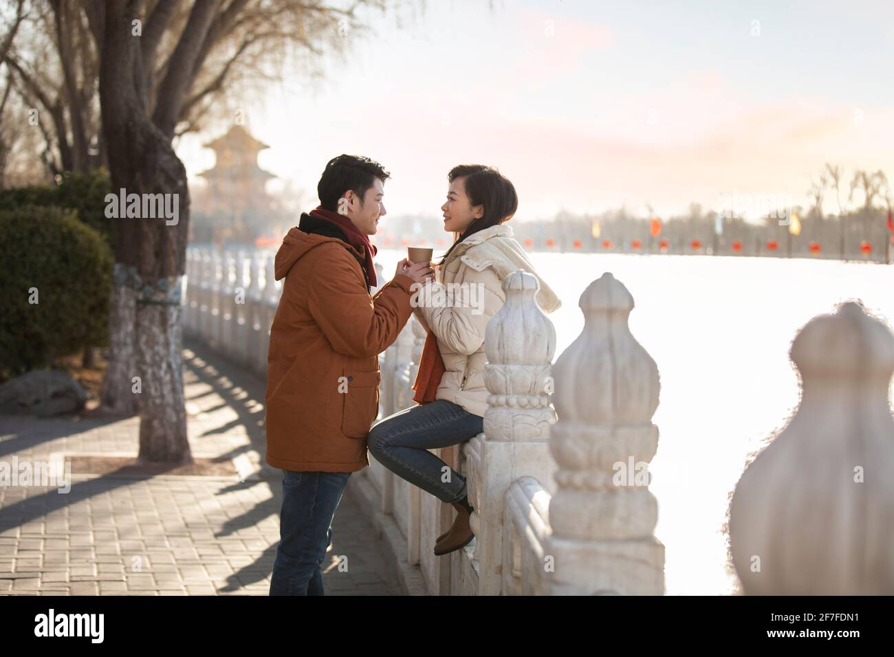 Happy young couple dating outdoors in winter Stock Photo - Alamy