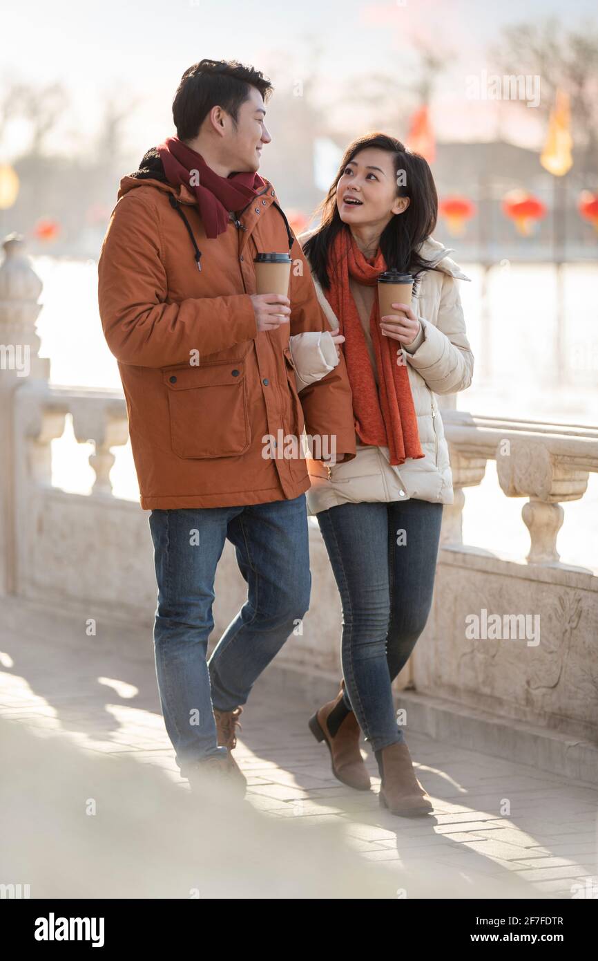 Happy young couple dating outdoors in winter Stock Photo - Alamy