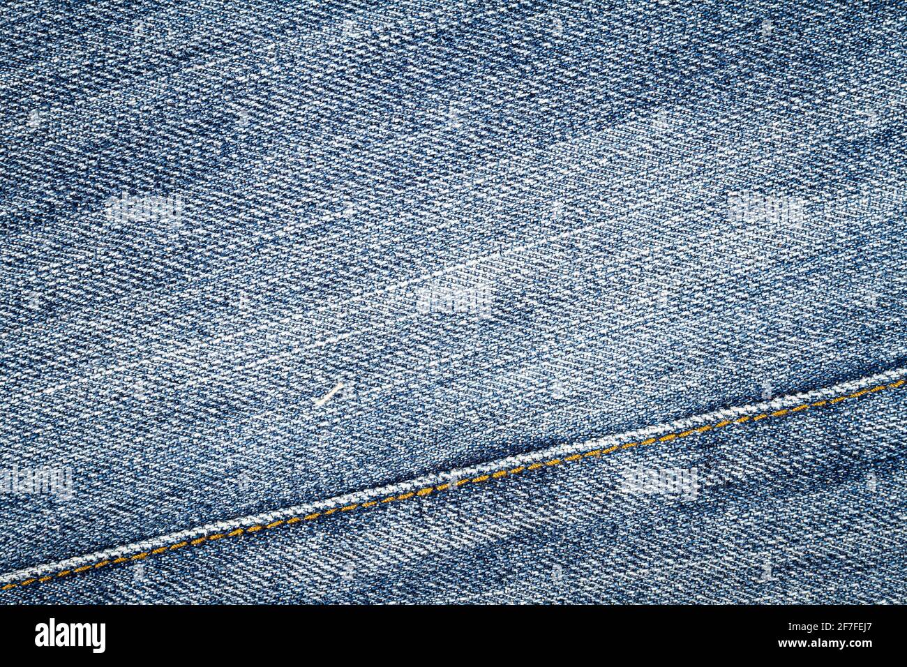 Light blue jeans texture. Denim fabric background with a seam Stock ...