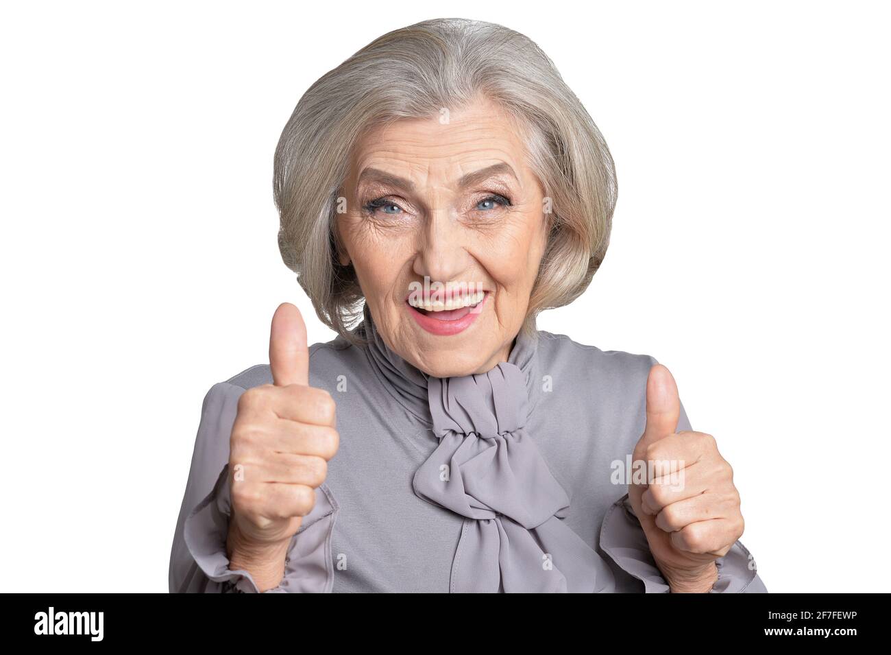 Portrait of happy senior woman showing thumbs up Stock Photo - Alamy