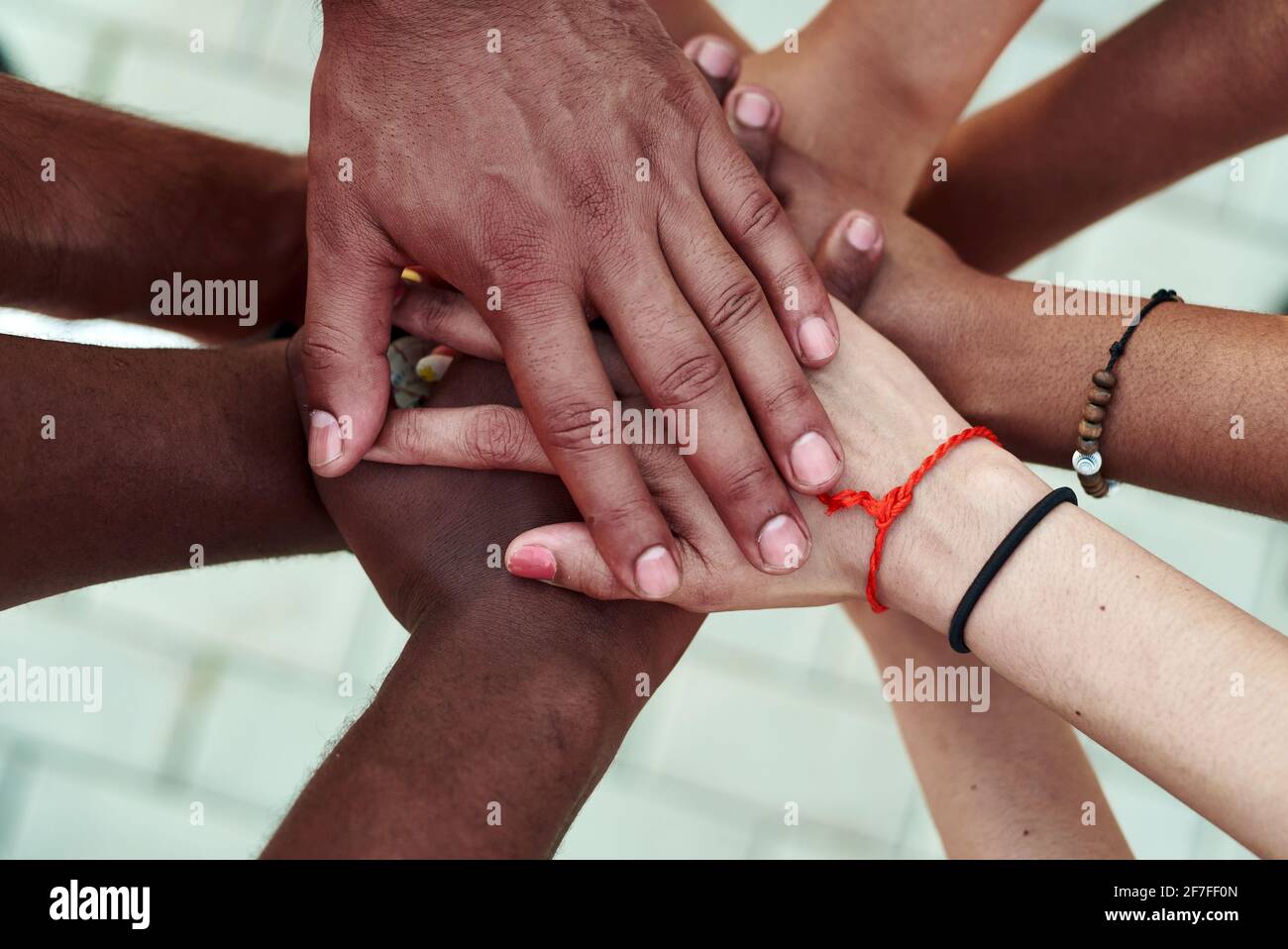 Black people with hands joined. Group of people stacking hands together ...