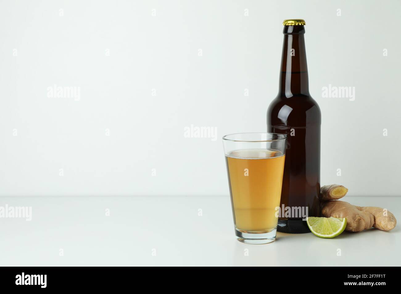 Glass and bottle of ginger beer on white background Stock Photo - Alamy