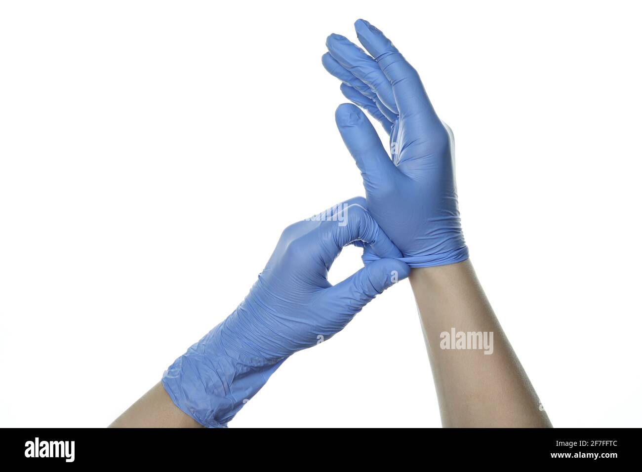 Hands putting on medical gloves, isolated on white background Stock ...